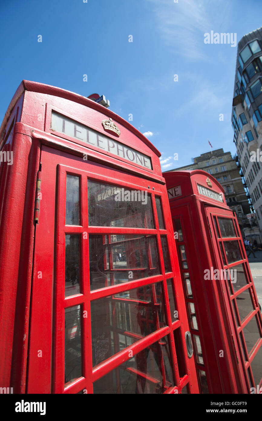 Red telephone boxes in a line outside Charing Cross train station ...