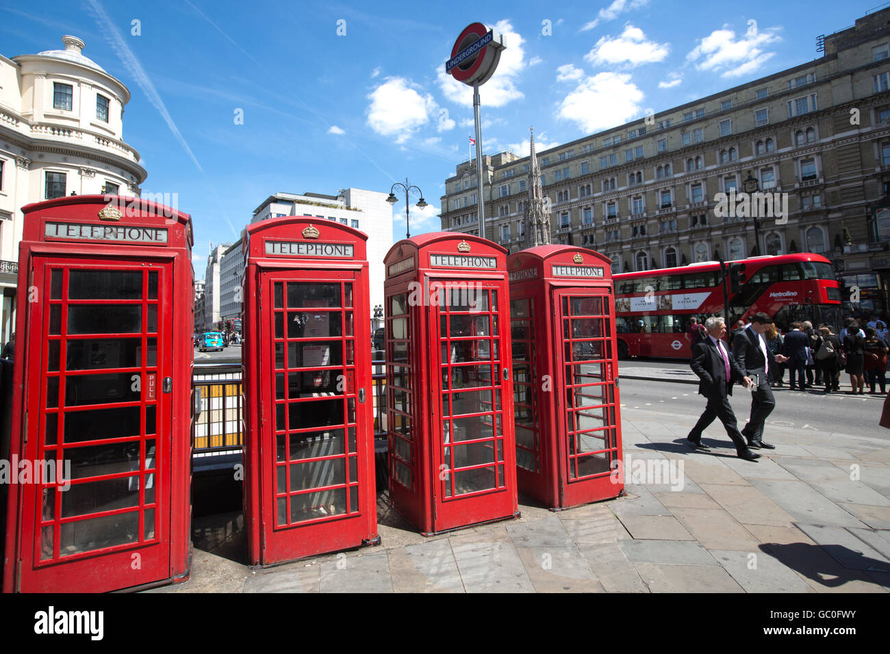 Red telephone boxes in a line outside Charing Cross train station ...
