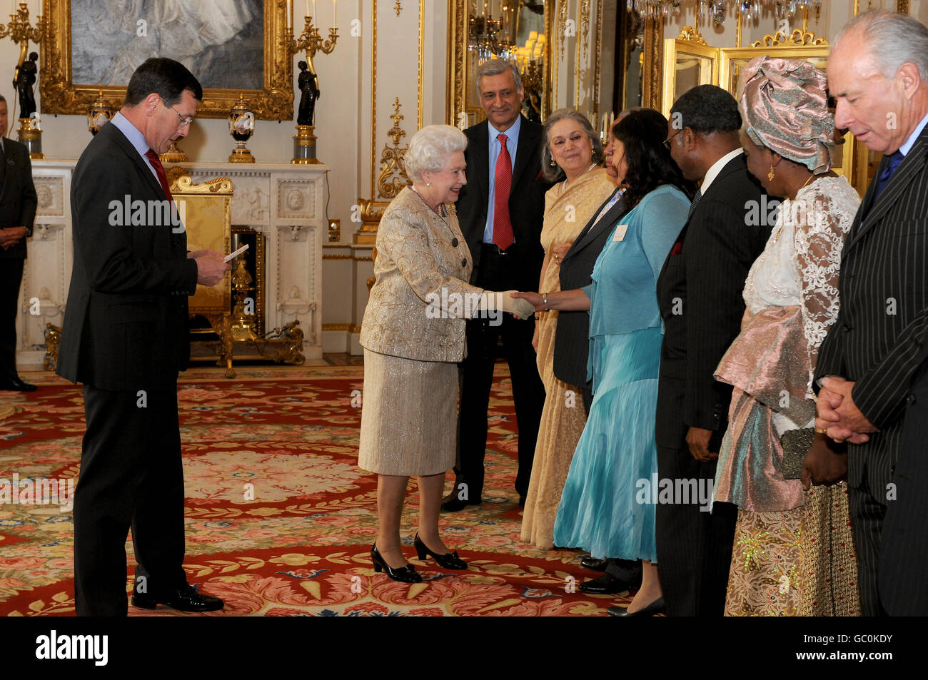 Britain's Queen Elizabeth II speaks with guests as she hosts a ...