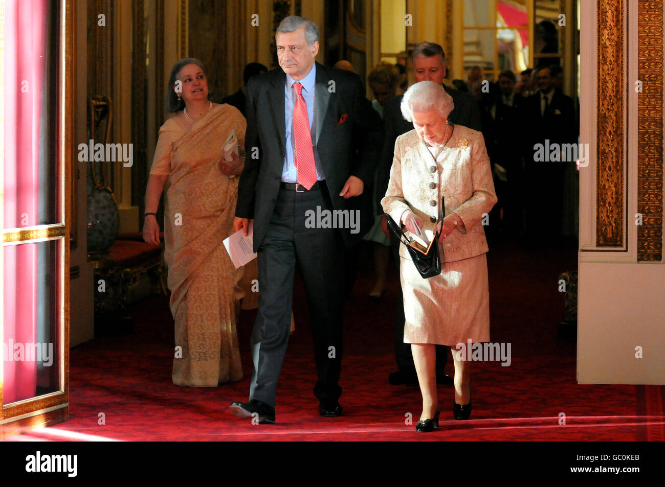 Britain's Queen Elizabeth II with guests as she hosts a reception to ...