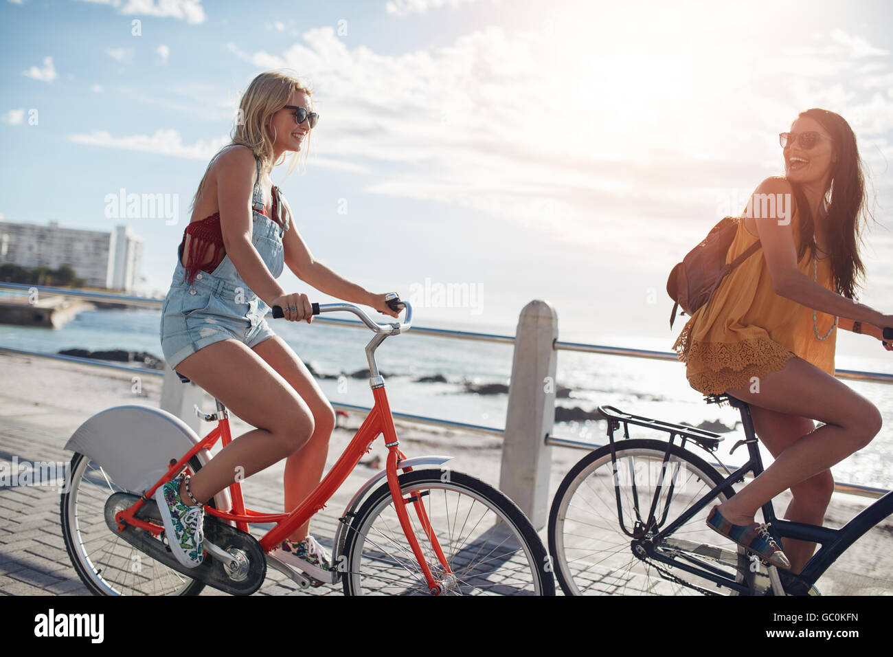 Two young women bicycles hi-res stock photography and images - Alamy