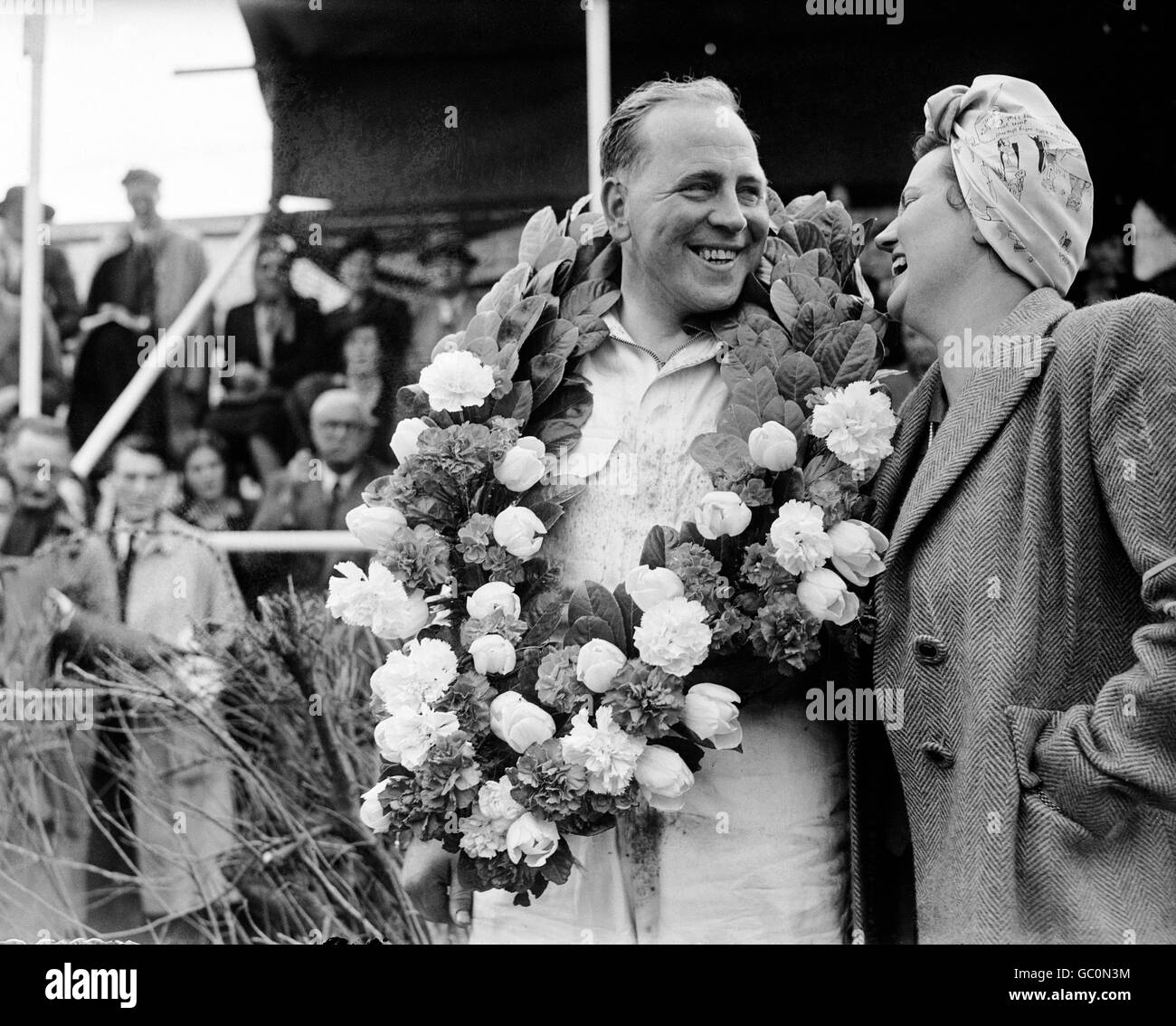 (L-R) Reg Parnell celebrates victory with Betty Wright Stock Photo - Alamy