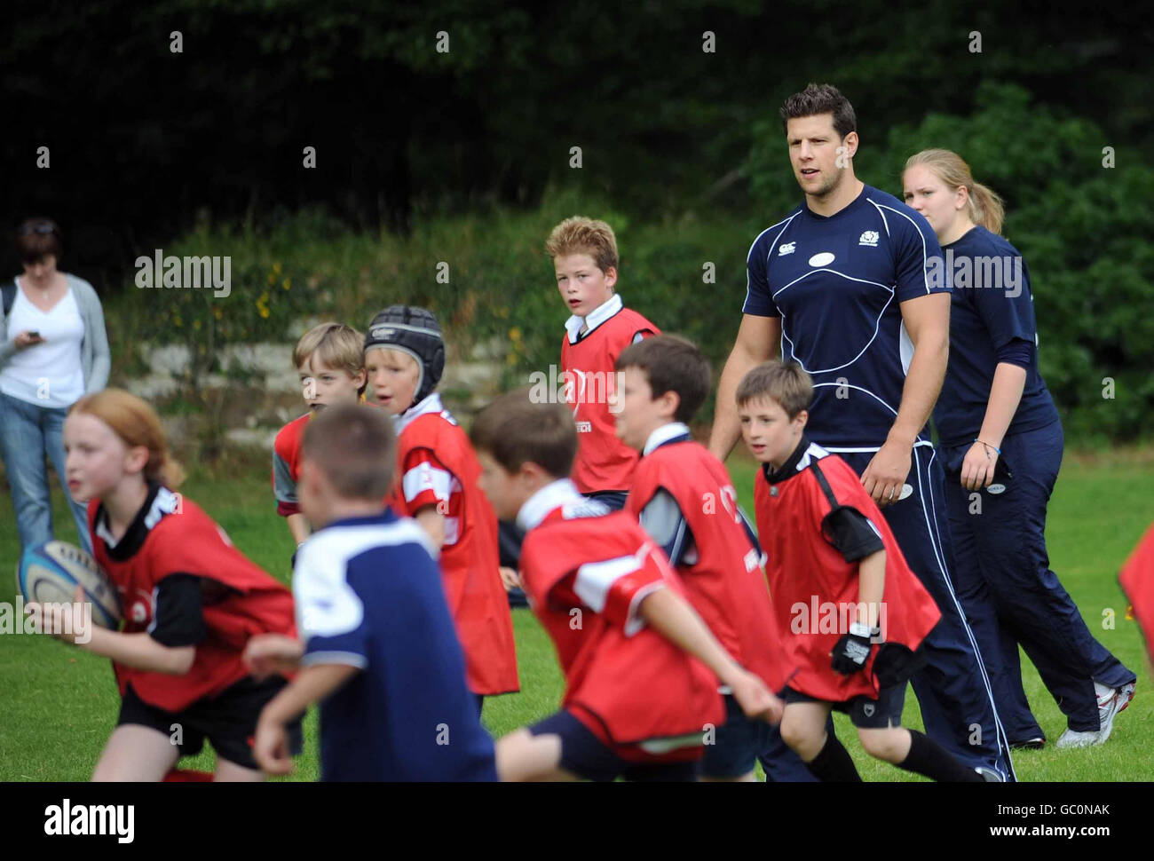 Scotland's Dave Callam with youngsters during the Scotland Rugby Summer ...