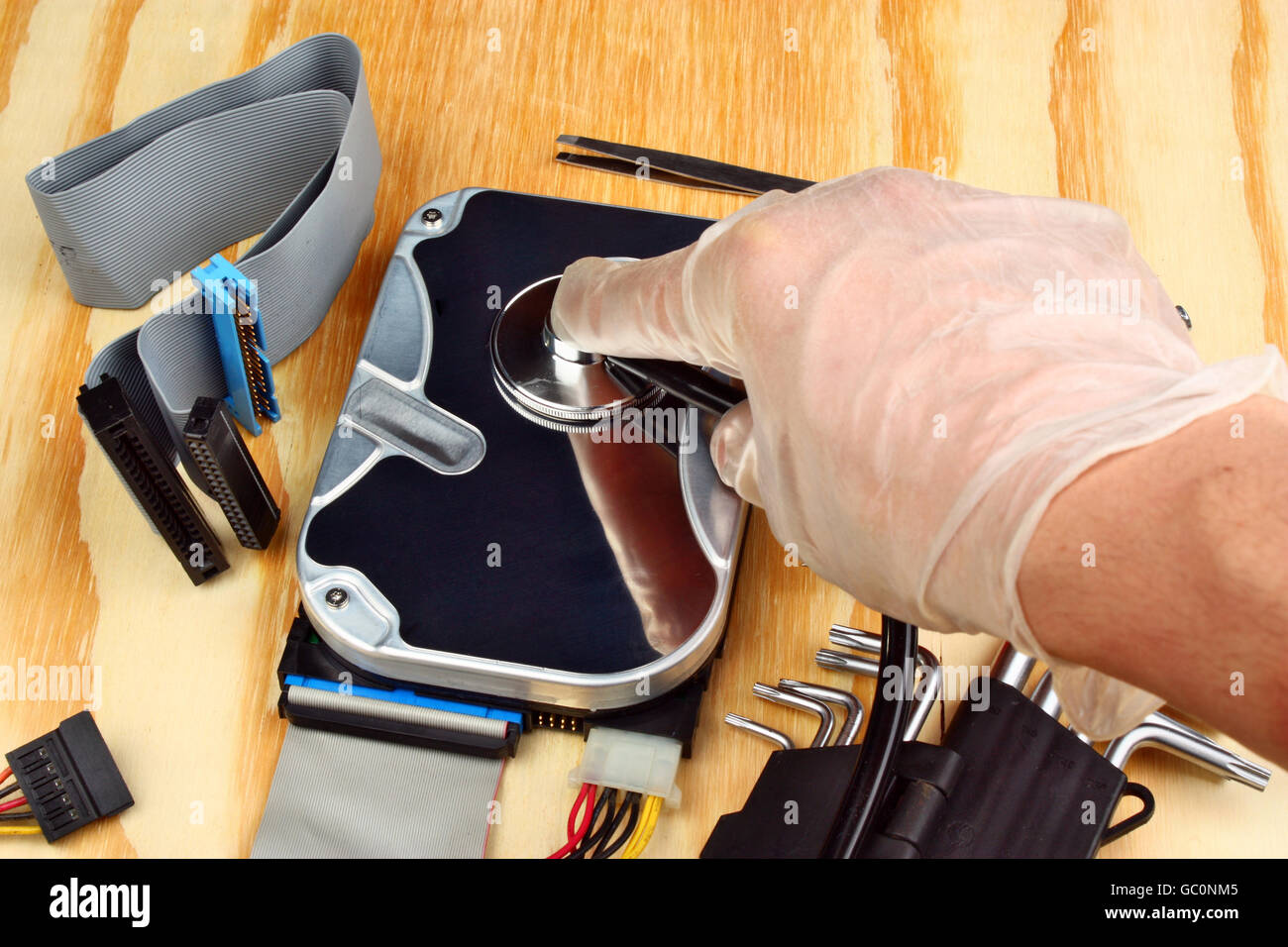 Hard disk with stethoscope on a wooden table Stock Photo - Alamy