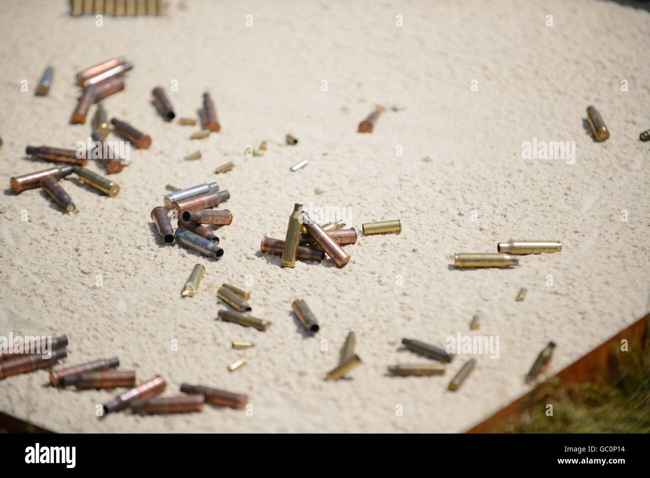 Bullets spent cases on sand hi-res stock photography and images - Alamy