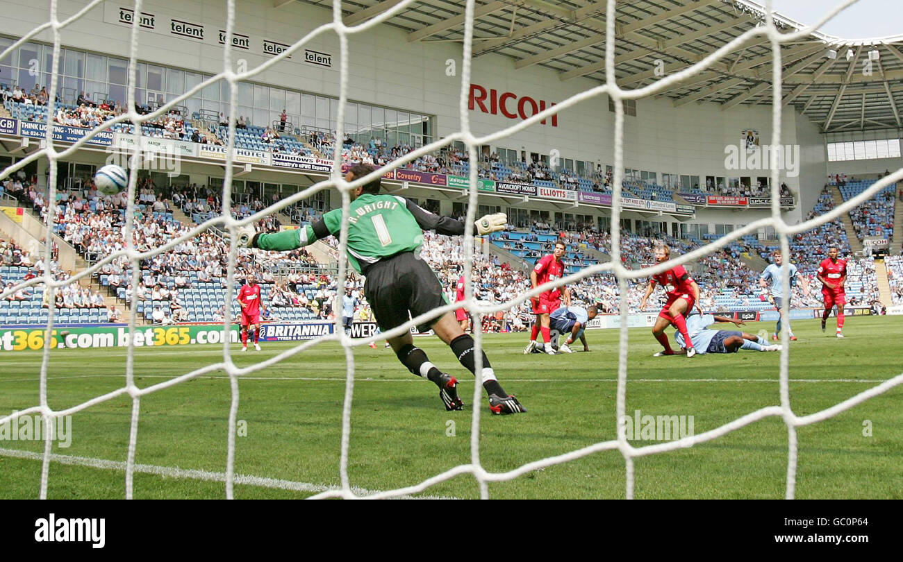 Coventry City's Clinton Morrison puts the ball past Ipswich Goalkeeper ...