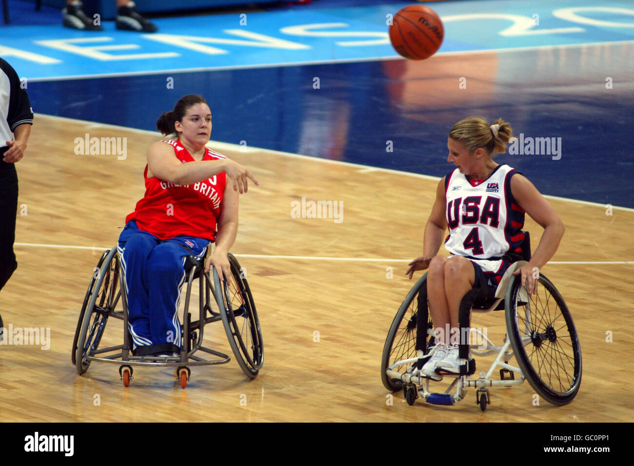Great Britain's Sarah Burrett passes under pressure from USA's Caroline ...