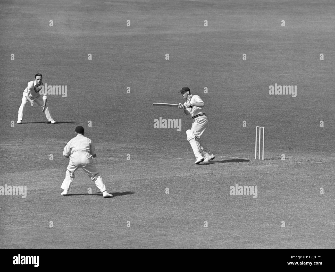 Sir Derrick Bailey, Gloucestershire captain, driving a ball from Alan ...