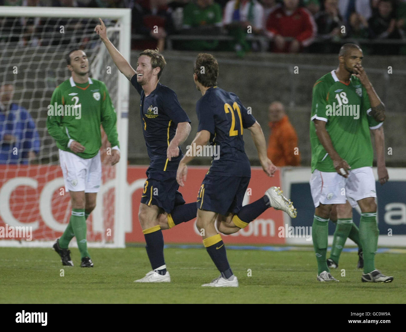 Australia's David Carney celebrates scoring the third goal of the game ...