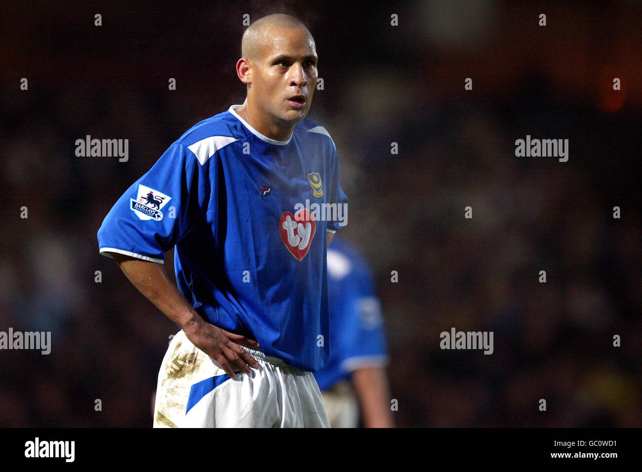 Portsmouth's Nigel Quashie stands dejected after the defeat against ...