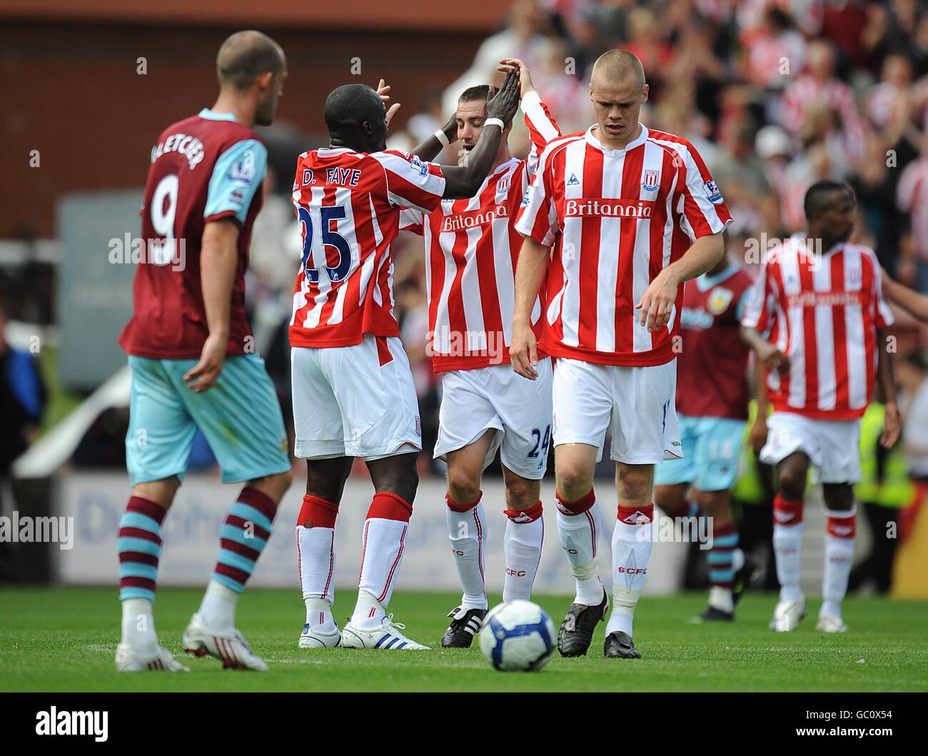 Stoke City's Rory Delap (centre) celebrates with his team mates after ...