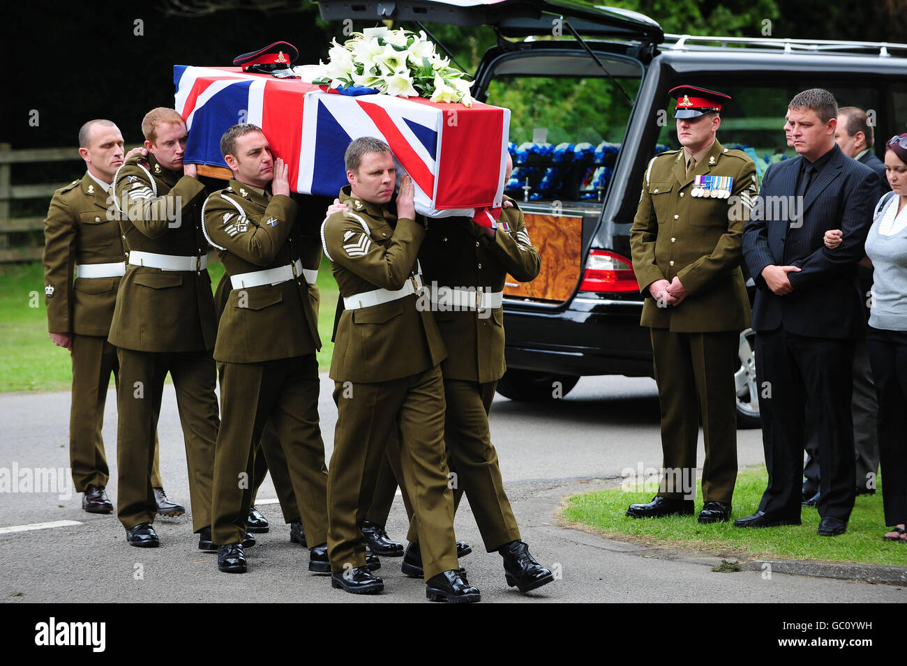 The coffin of Warrant Officer Sean Upton, arrives at his funeral at ...