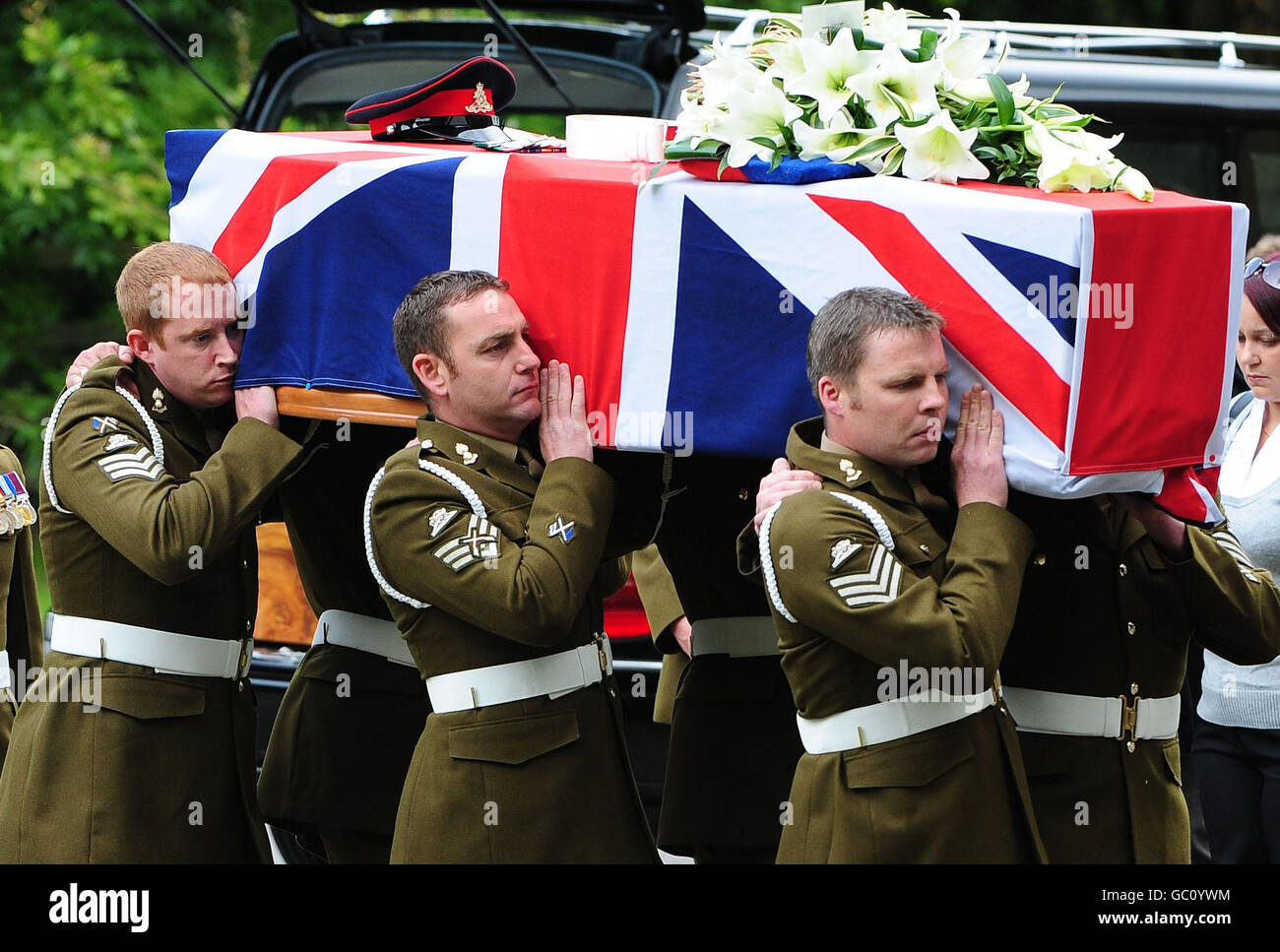 The coffin of Warrant Officer Sean Upton, arrives at his funeral at ...