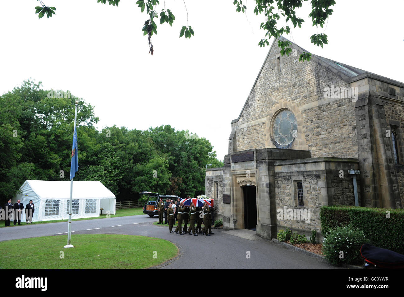 The coffin of Warrant Officer Sean Upton, arrives at his funeral at ...