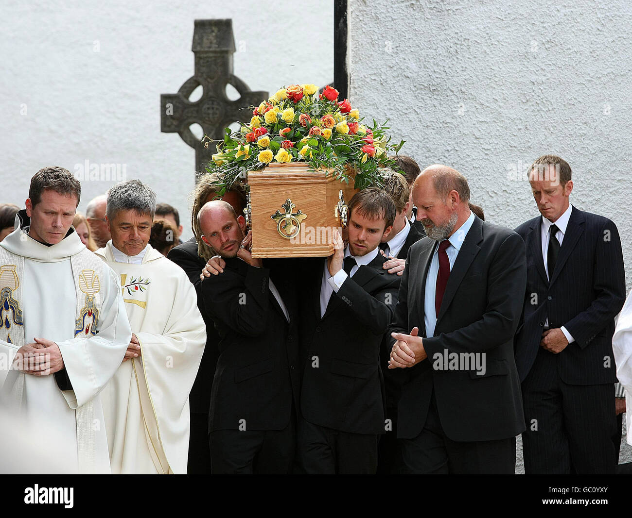 The coffin of charity worker Robert De Courcey Stringer arrives at St ...