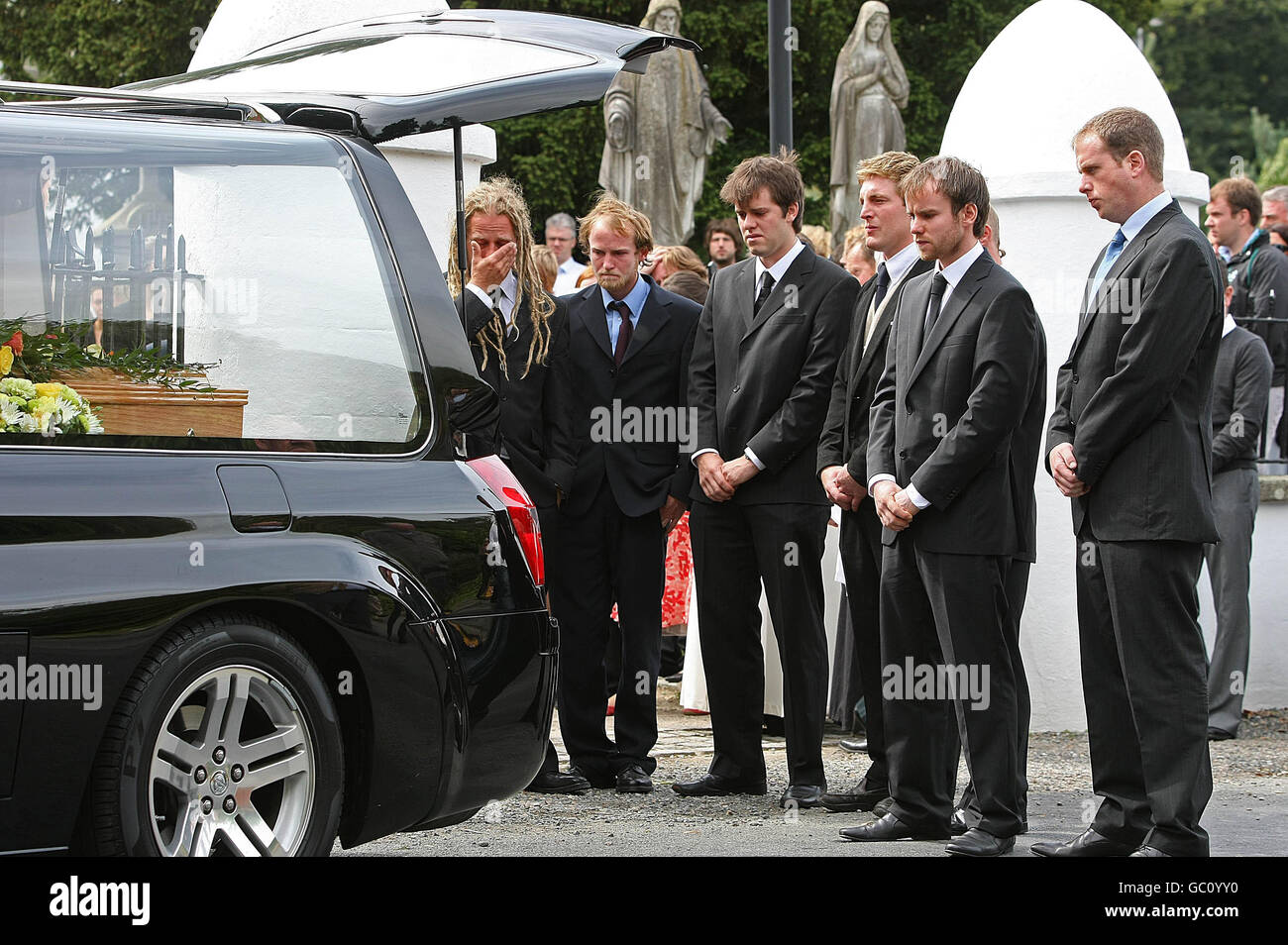The coffin of charity worker Robert De Courcey Stringer arrives at St ...