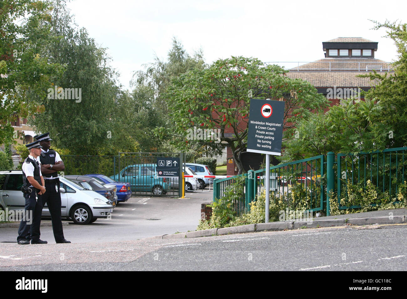 Two police officers stand on guard at Wimbledon Magistrate's Court in ...