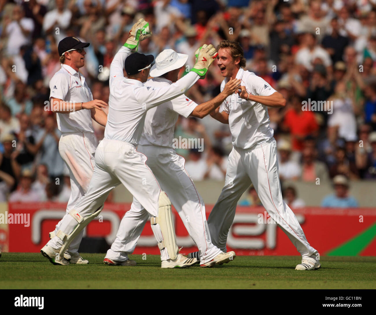 England's Stuart Broad (r) celebrates taking the wicket Australia's ...