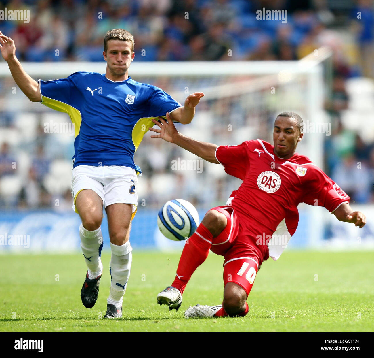 Cardiff's Adam Matthews is challenged by Bristol City's Nicky Maynard ...