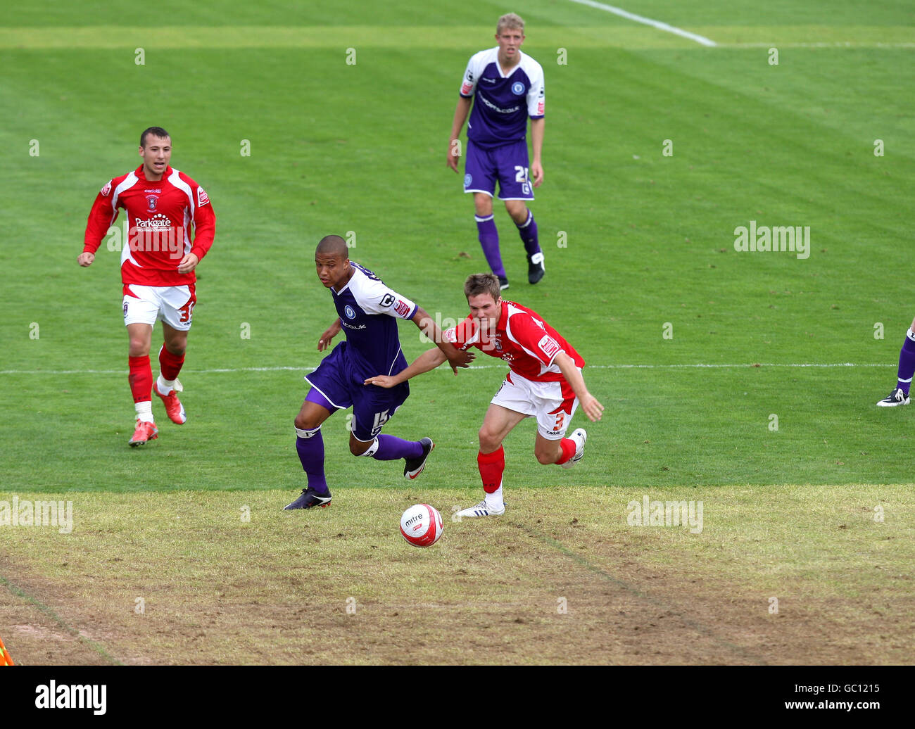 Rotherham United's Jamie Green and Rochdale's Joe Thompson battle for ...