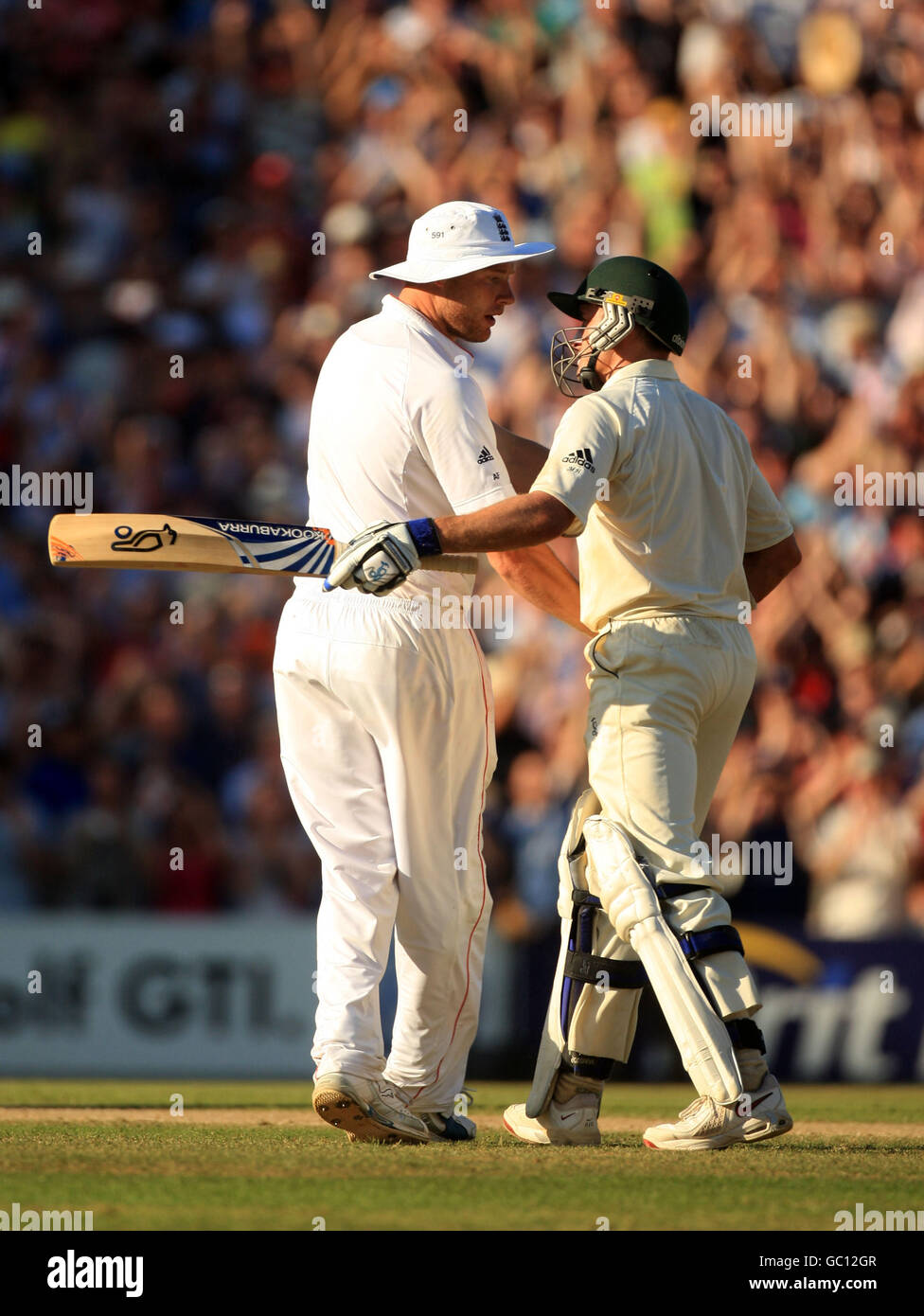 England's Andrew Flintoff comiserates Australia's Mike Hussey who ...