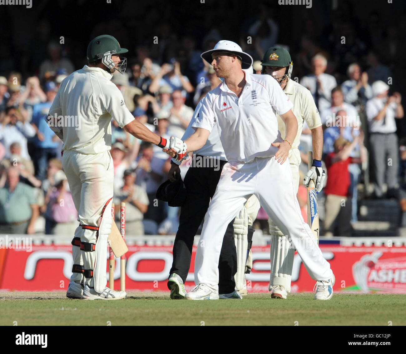 England's Andrew Flintoff consoles Australia's Ben Hilfenhaus after ...