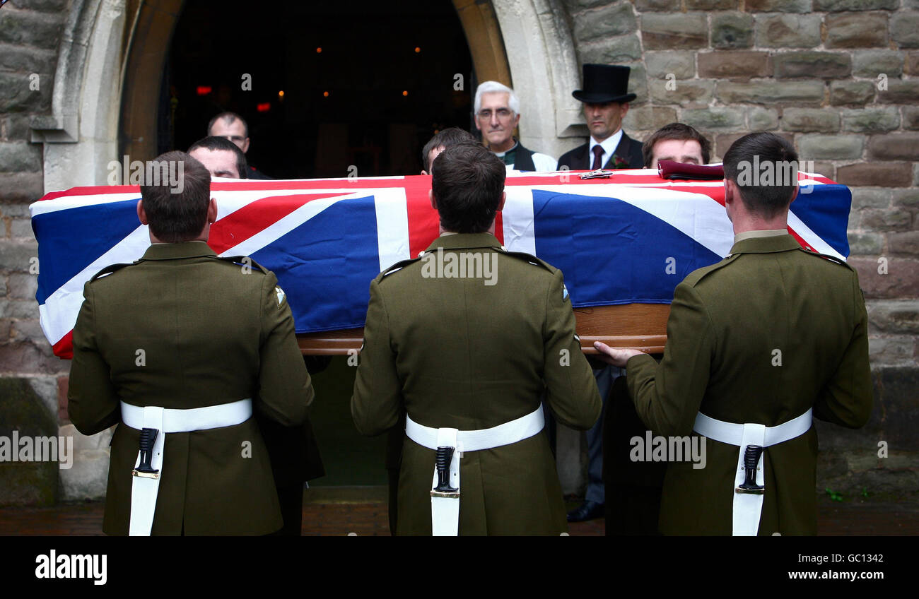 Lance Corporal Dale Hopkins coffin is carried by colleagues into his ...