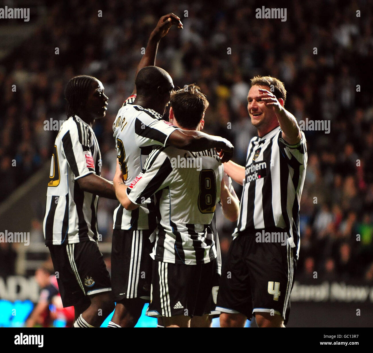 Newcastle's Shola Ameobi celebrates Kevin Nolan's goal after he set him ...