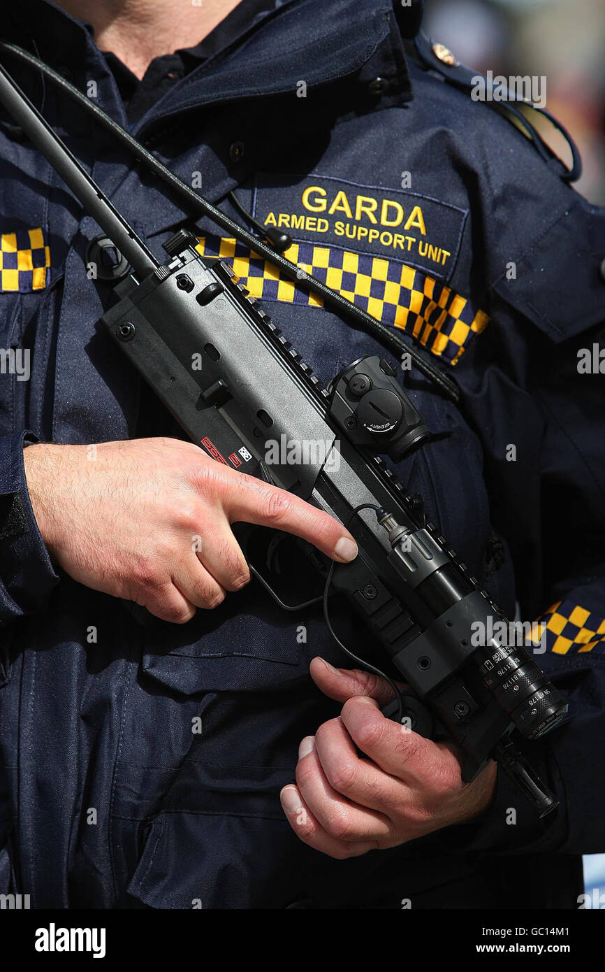 Armed Gardai beside one of the vehicles of the newly formed Eastern ...