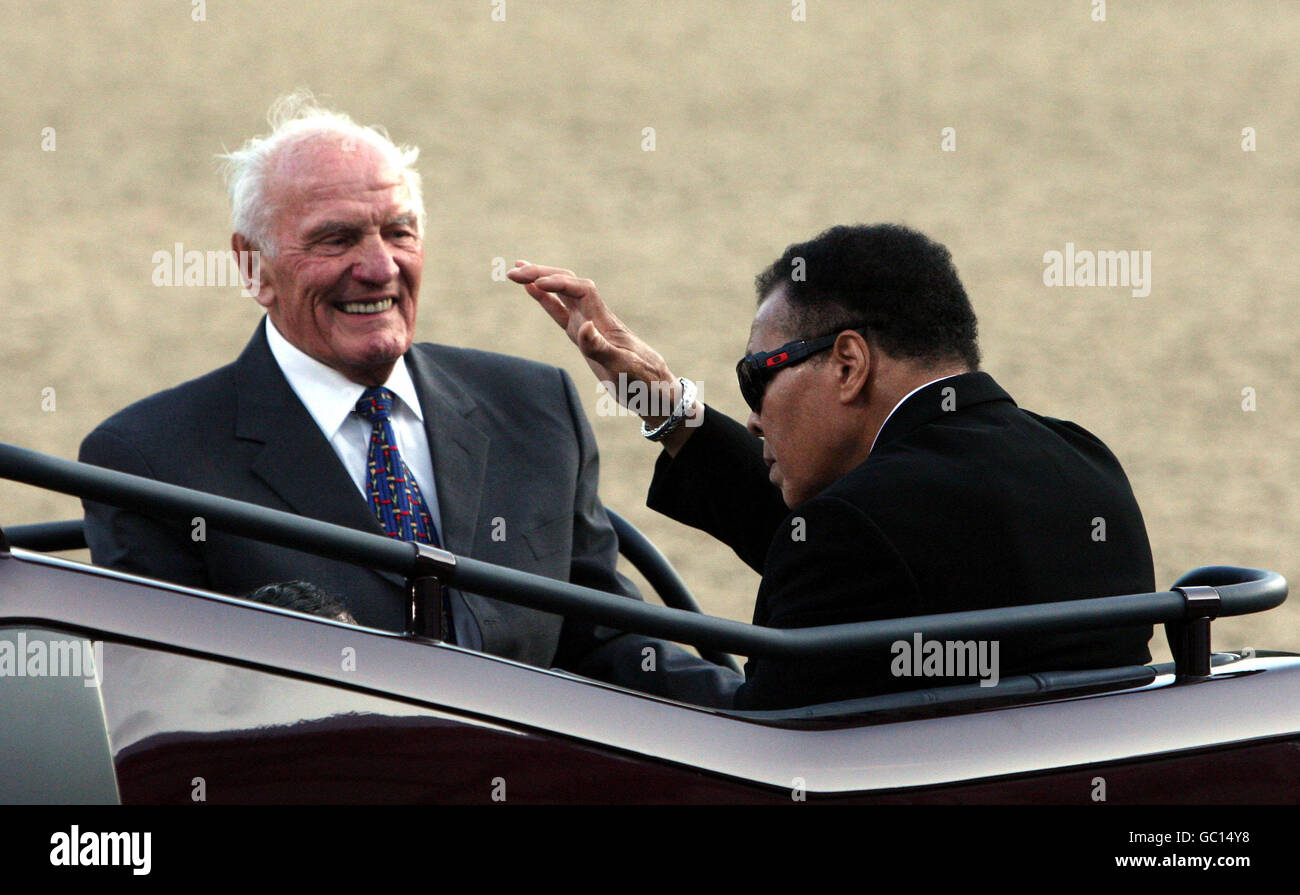 Ali Cooper reunion. Muhammad Ali and Sir Henry Cooper wave to the crowd ...
