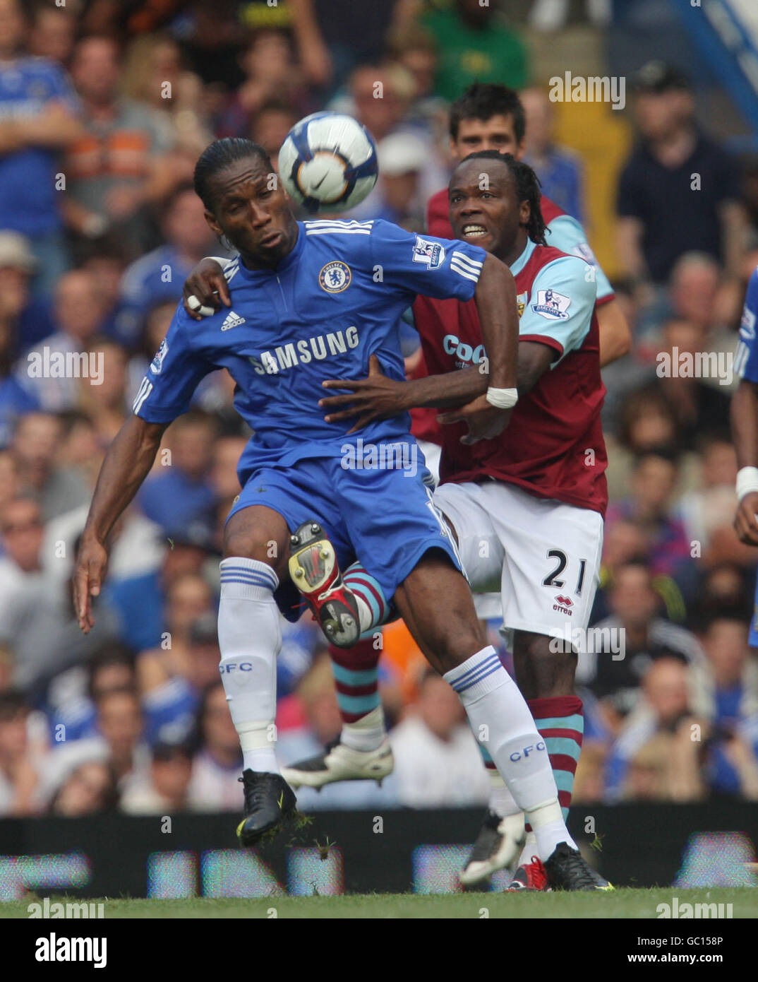 Didier Drogba of Chelsea holds off Andre Bikey of Burnley Stock Photo ...
