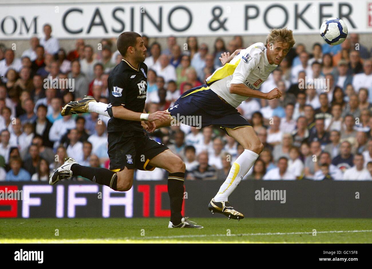 Birmingham City's Stuart Parnaby and Tottenham Hotspur's Peter Crouch ...