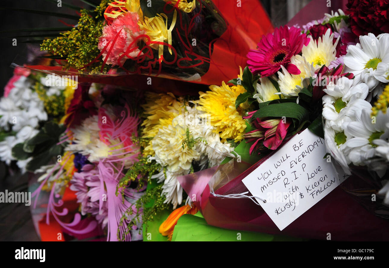 Floral tributes including a message from jockey Kieren Fallon (shown ...