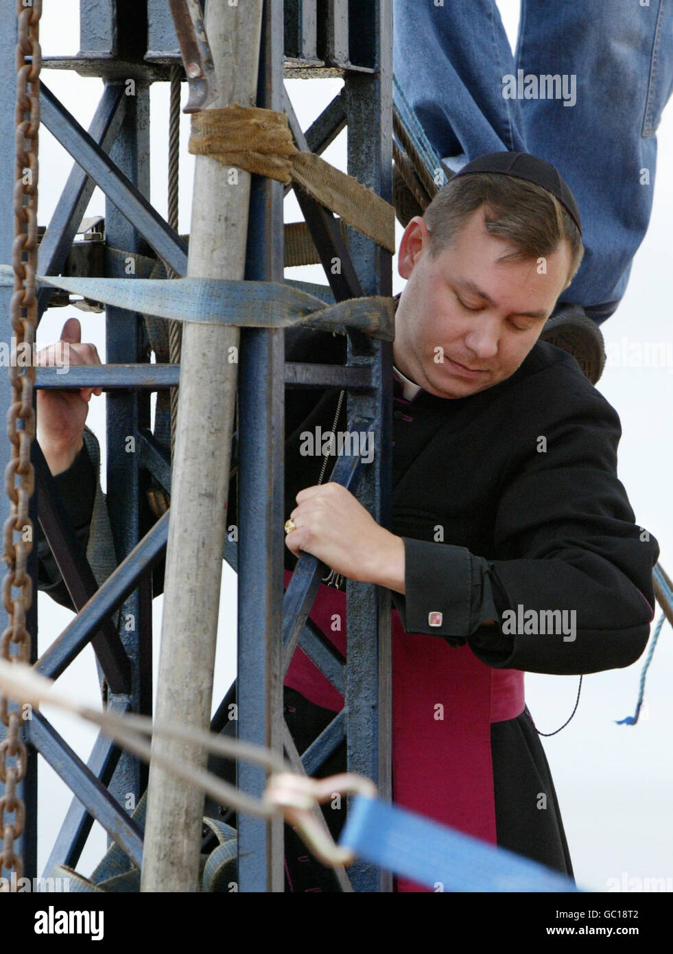 High wire walking priest Stock Photo - Alamy