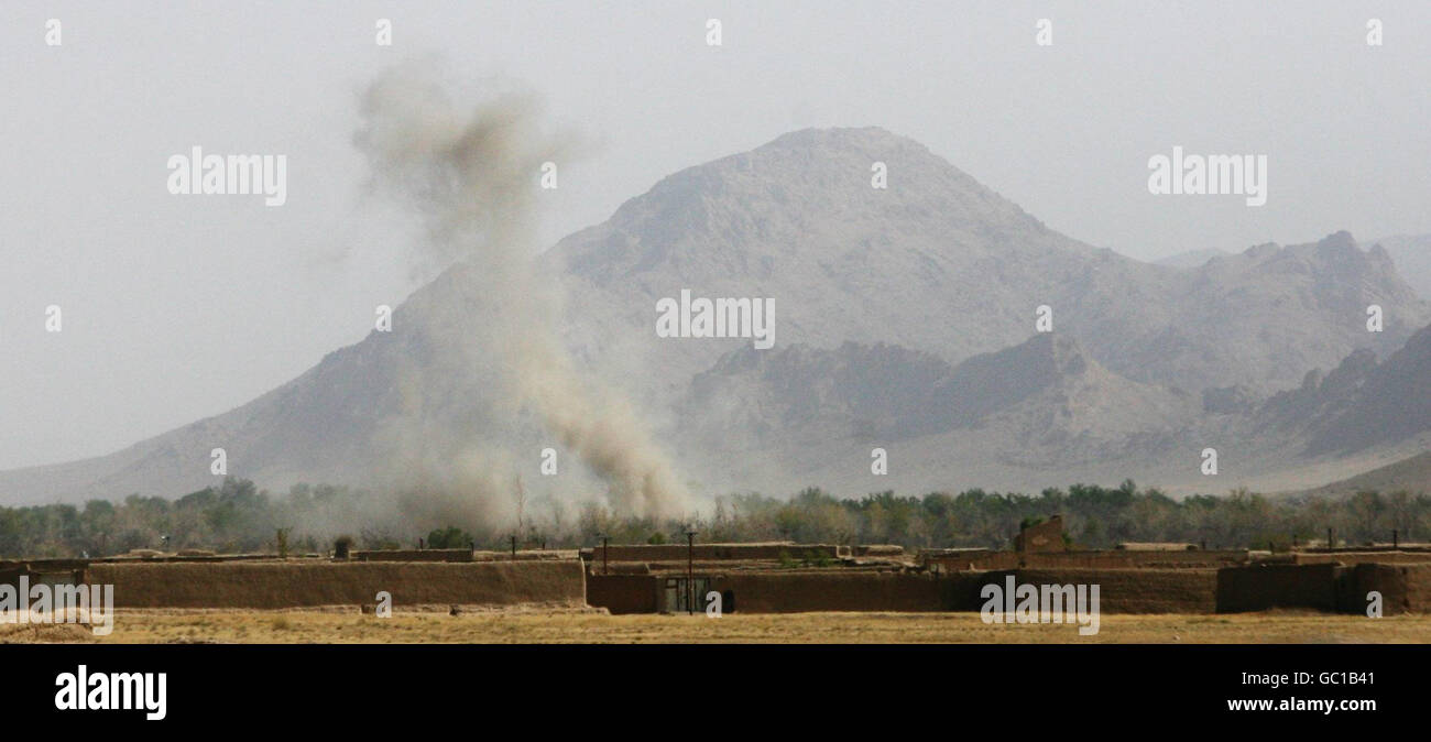 An explosion is seen as American troops return fire on a Taliban mortar ...