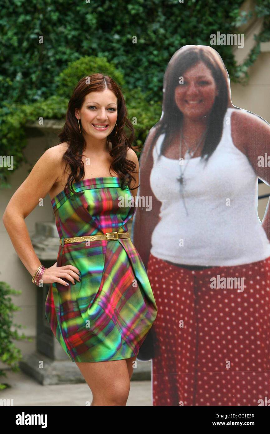 Holds up cardboard cut out of her as size 22 hi-res stock photography ...
