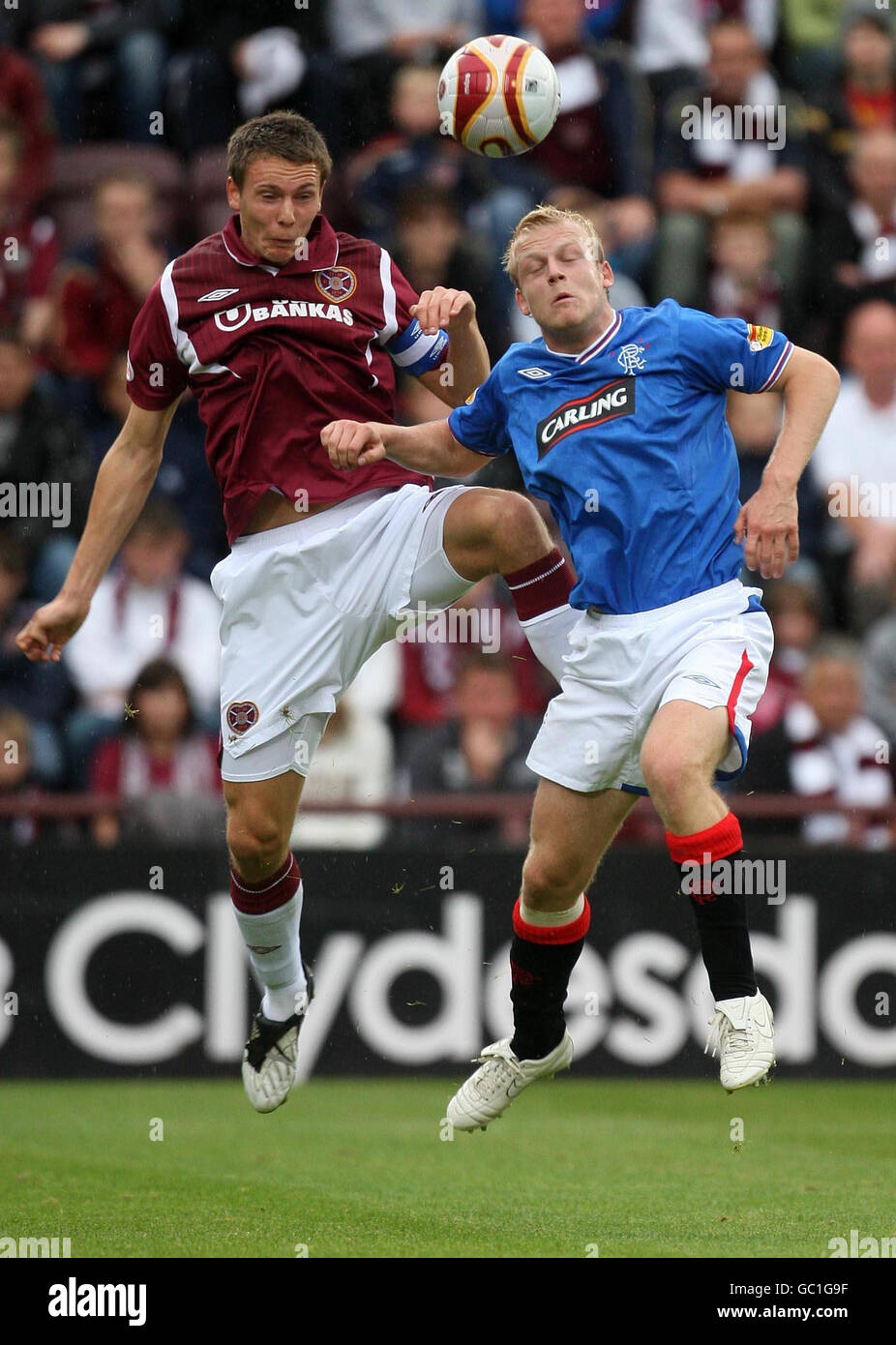 Rangers' Steven Naismith and Hearts' Eggert Jonsson battle for the ball ...