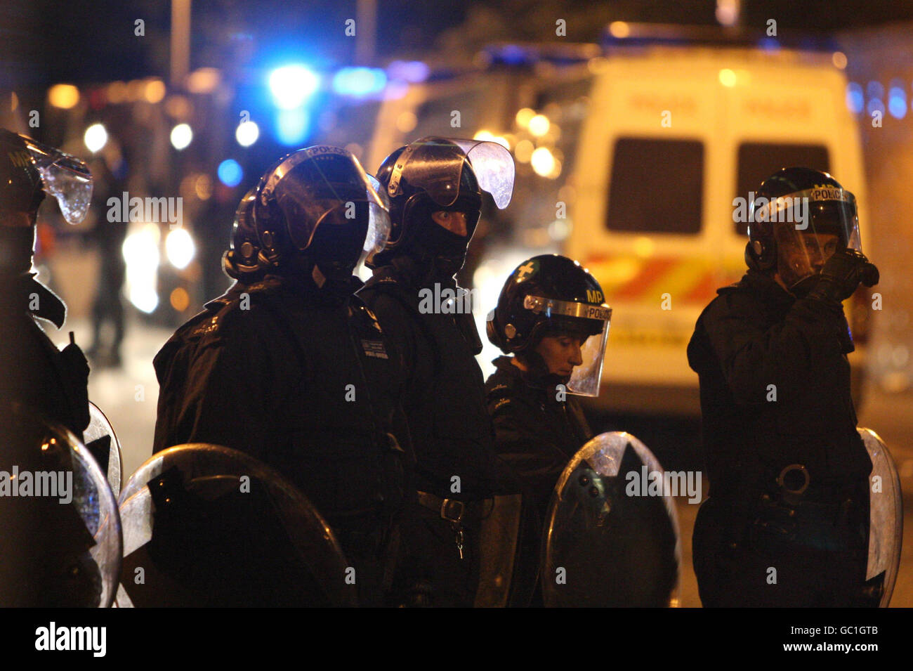 Police officers in riot gear on Priory Road, outside Upton Park, east ...