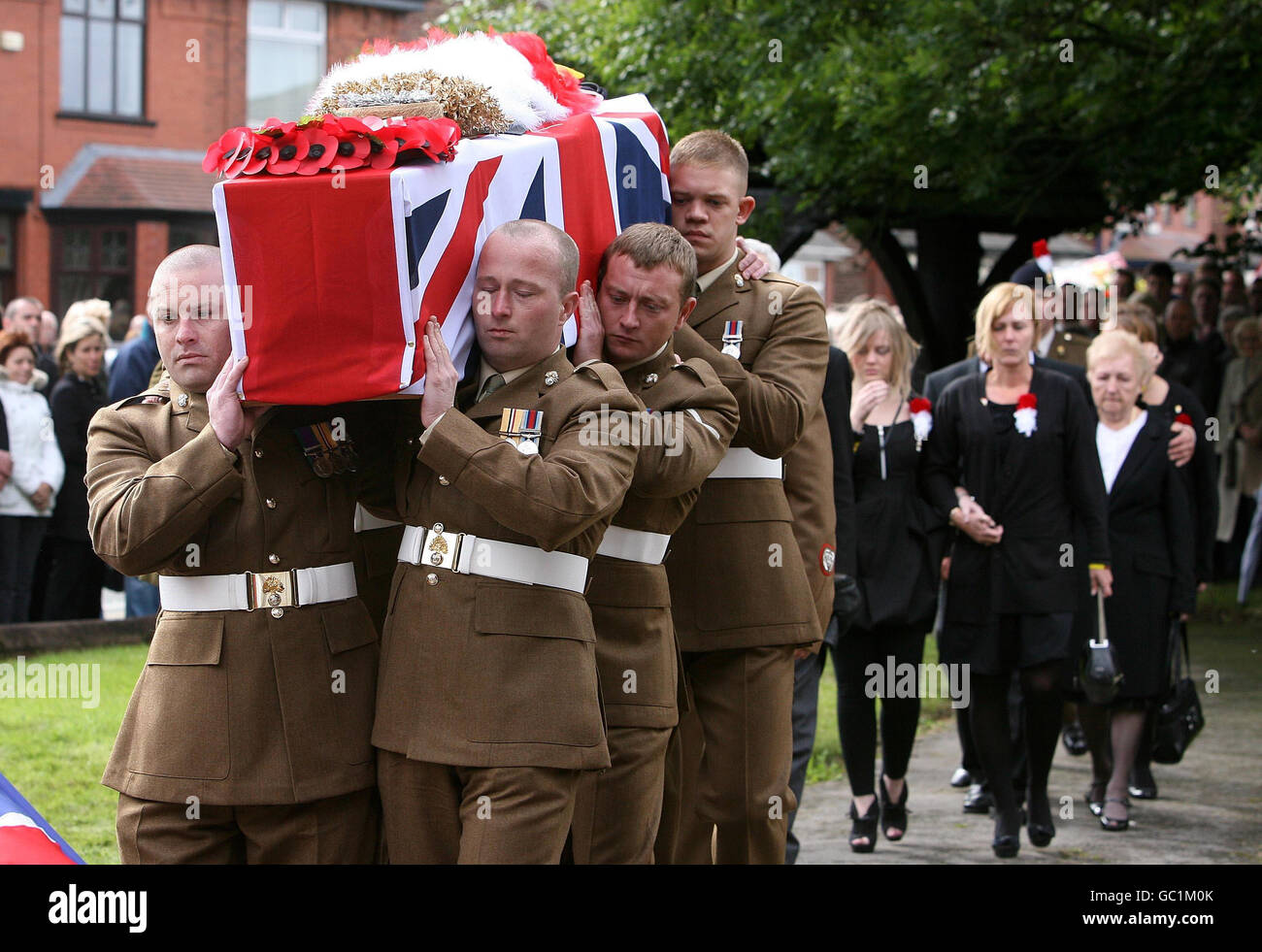 The coffin of Fusilier Simon Annis, 22, is carried into the church of ...