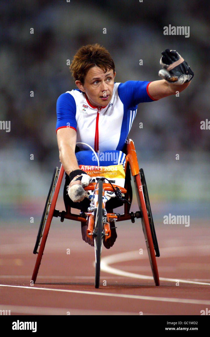 Great Britain's Tanni Grey Thompson waves to her family after finishing ...