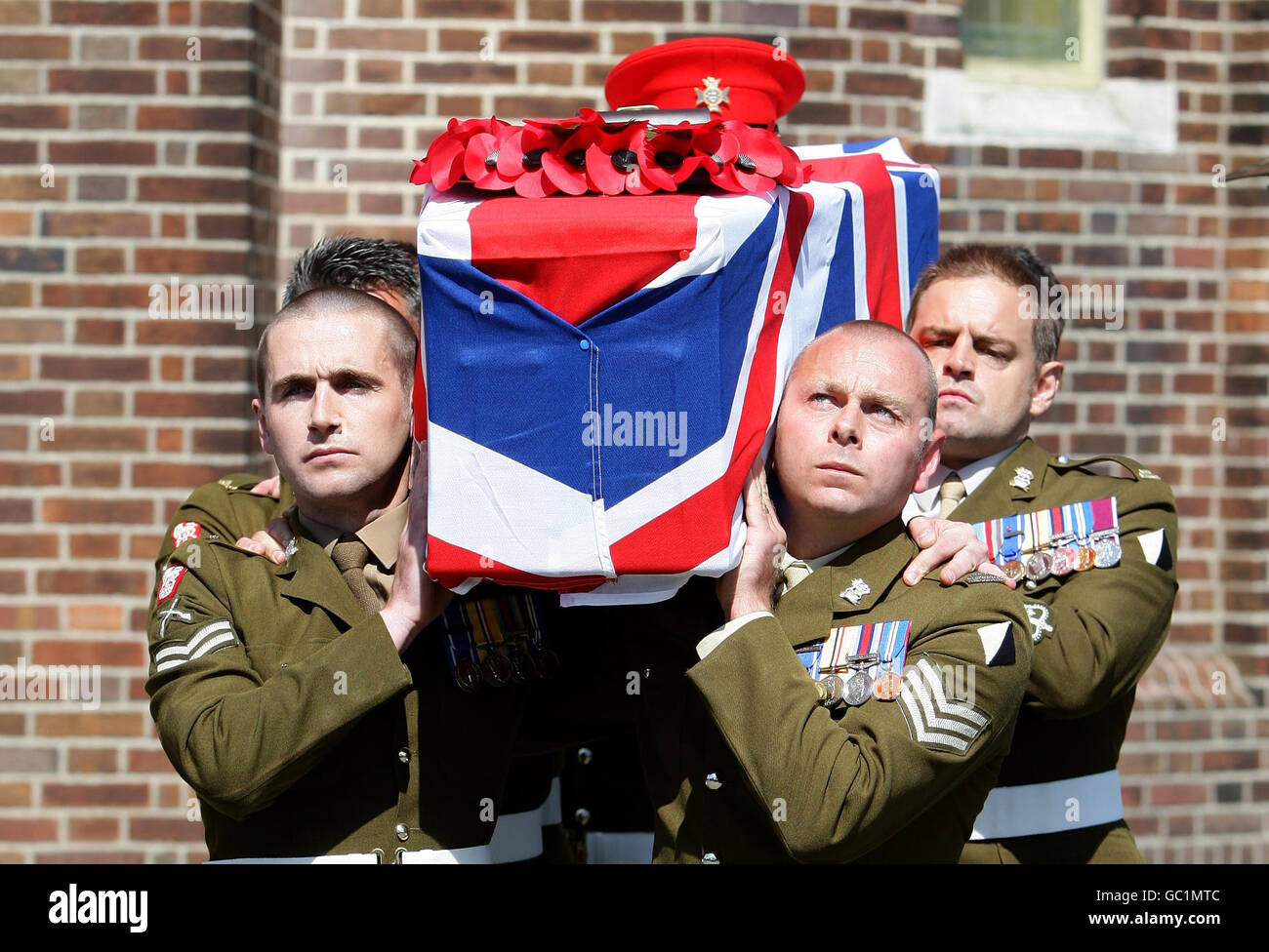 The coffin of Phillip Lawrence, 22, of the Light Dragoons is carried ...