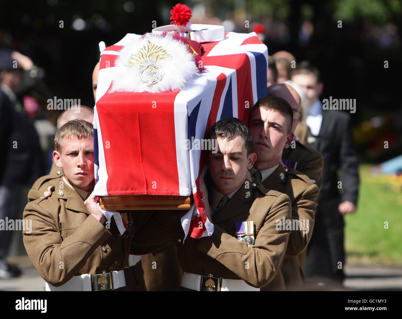 The coffin of Corporal Joseph Etchells, 22, is carried into St. George ...