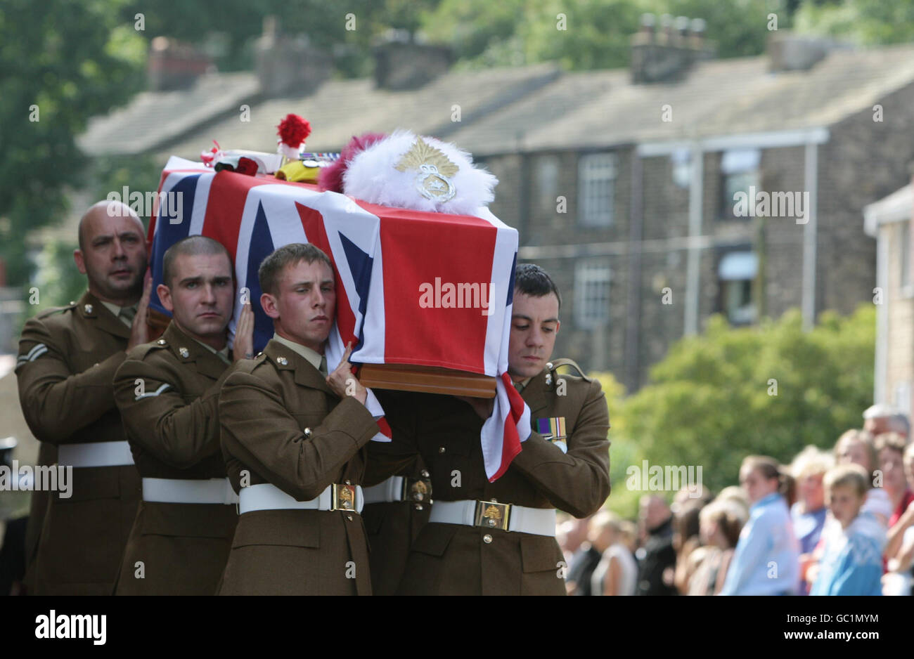 The coffin of Corporal Joseph Etchells, 22, is carried from St. George ...