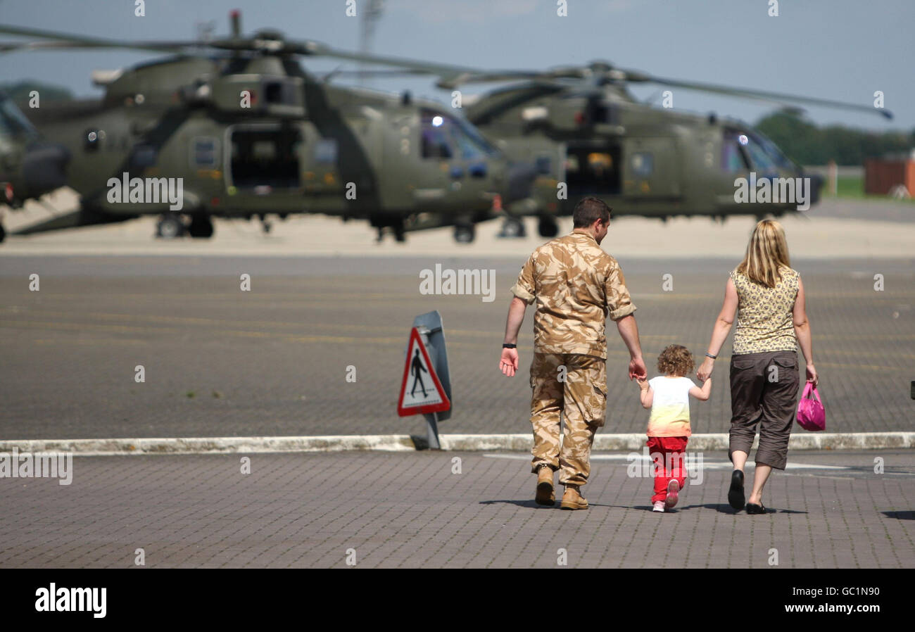 Personnel are met by families, as the last two Merlin helicopters ...