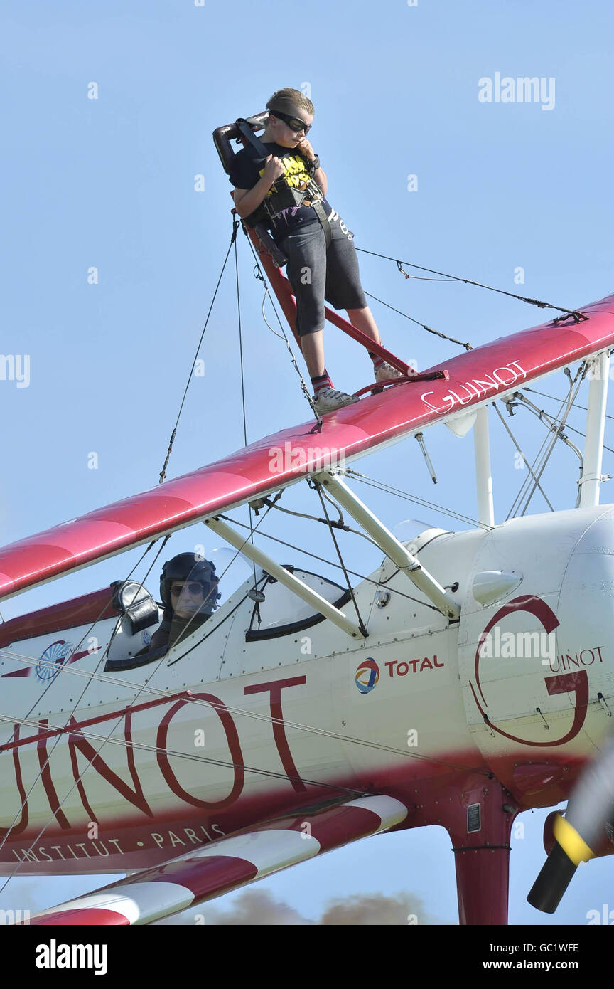 Eight-year-old Tiger Brewer wingwalks on his grandfather's biplane and ...
