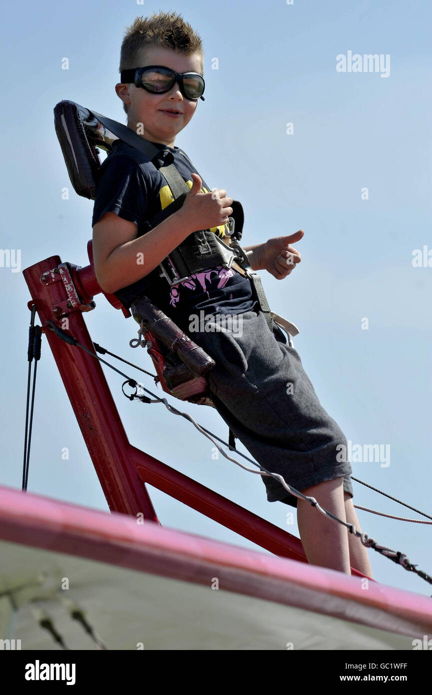 Eight-year-old Tiger Brewer wingwalks on his grandfather's biplane and ...