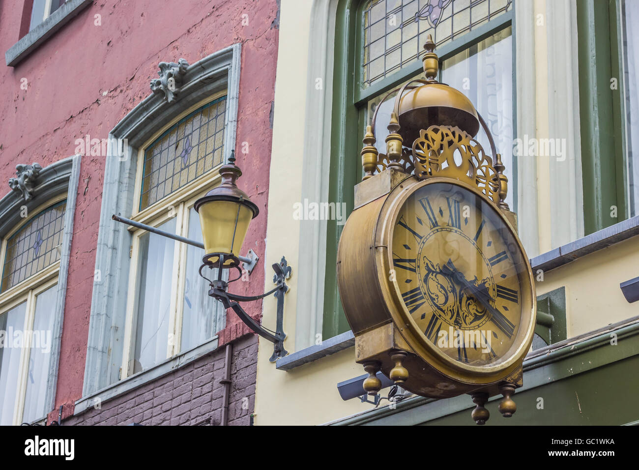 Old street clock in the old center of Nijmegen, Holland Stock Photo - Alamy