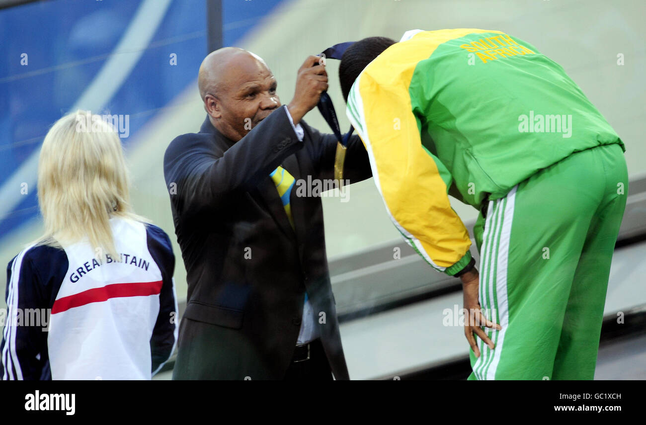 Leonard Chuene the IAAF representative for South Africa presents South Africa's Caster Semenya ...