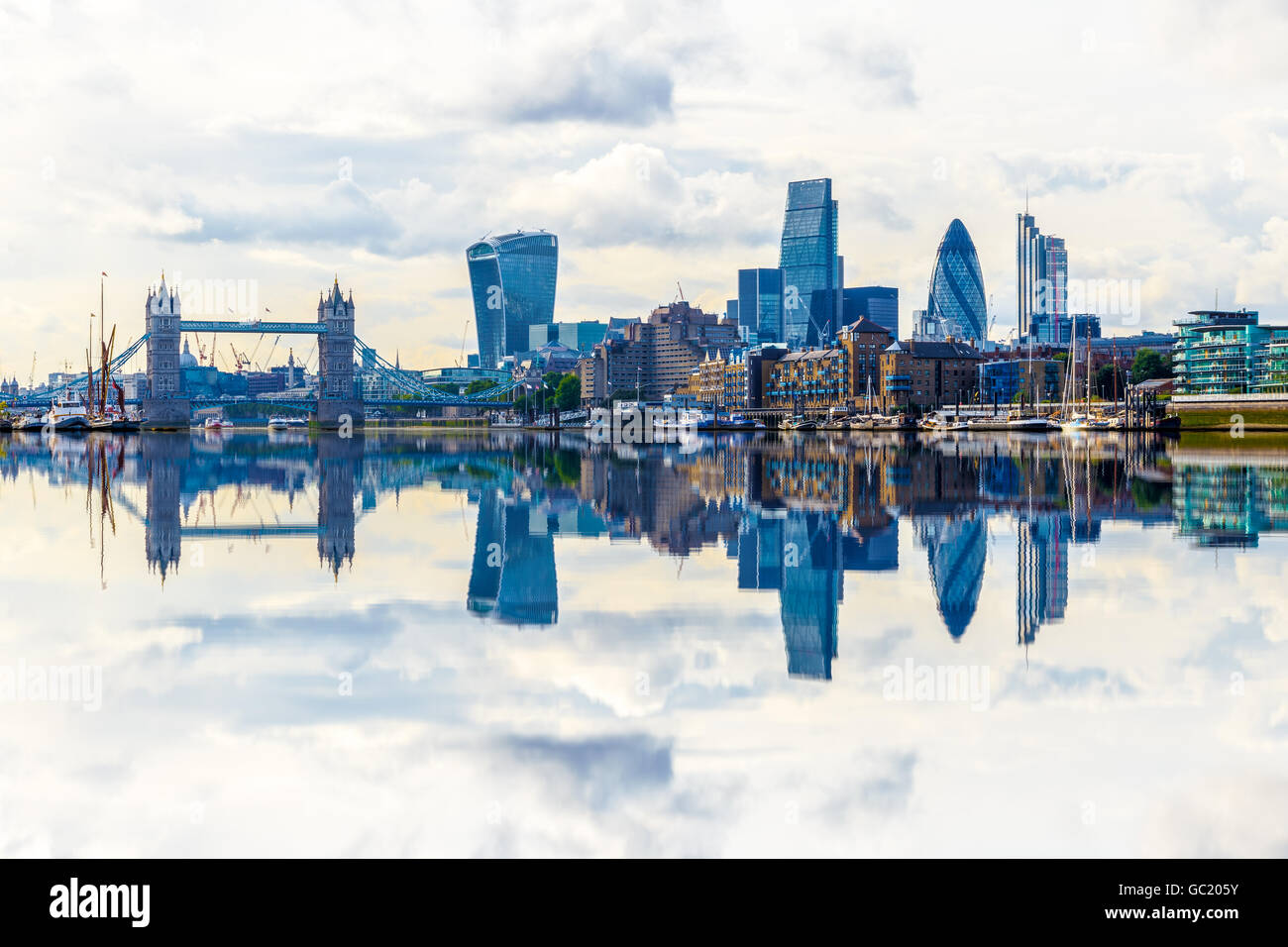 London cityscape with dramatic clouds with its reflection from river ...