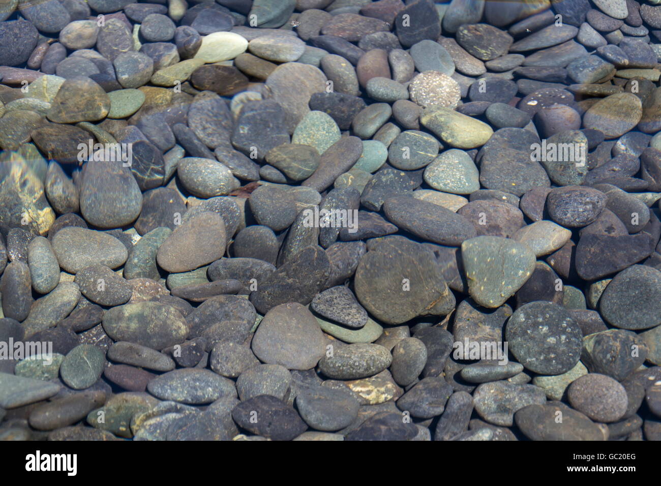 Picture full of stone pebbles under water lake bed background Stock ...